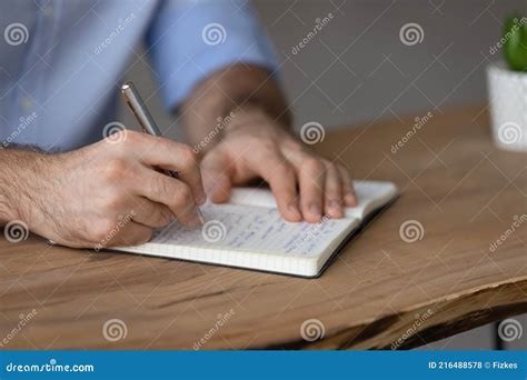 Close Up of Man Write in Notepad at Desk Stock Photo - Image of customer, education: 216488578