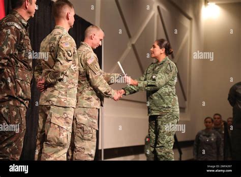 U.S. Army Special Forces Col. Ken Dwyer presents a diploma to Mexican ...