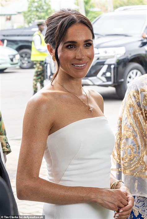 Meghan Markle insists she and Prince Harry are 'really happy' and 'doing great' as they watch ...
