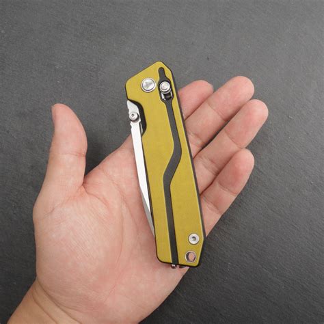 SRM7228LGW Couteau SRM Knives 7228L Yellow Ambi Lock Lame 10Cr15CoMoV ...