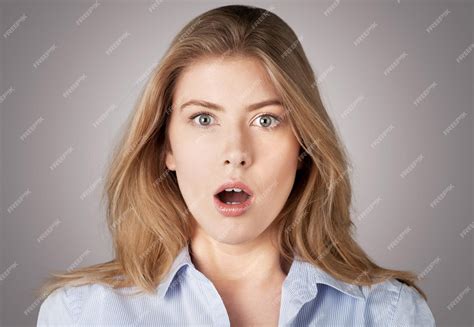 Premium Photo | Beautiful young woman with surprised expression