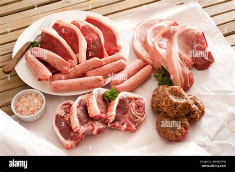 Assorted cuts of raw meat Stock Photo - Alamy