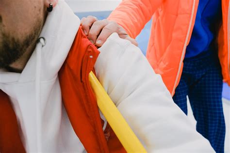 Hand of man on shoulder of player · Free Stock Photo