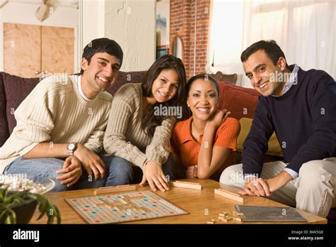 Multi-ethnic family playing board game Stock Photo - Alamy