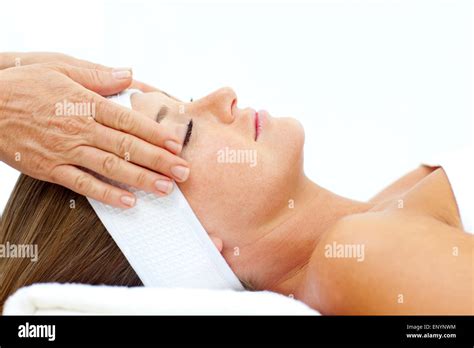 Asleep woman relaxing with head massage Stock Photo - Alamy