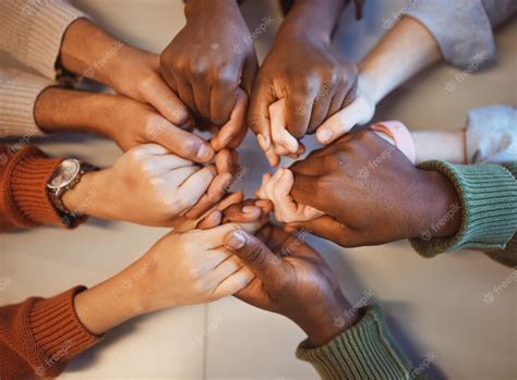 Premium Photo | Holding hands top view and group prayer of people with ...