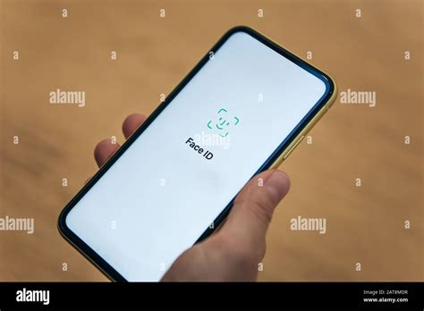 Person uses face id on cell phone Stock Photo - Alamy