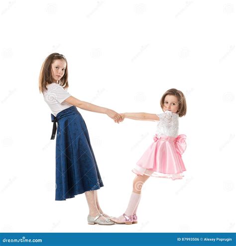 Two Sisters in Holiday Dresses Stock Photo - Image of blue, caucasian ...
